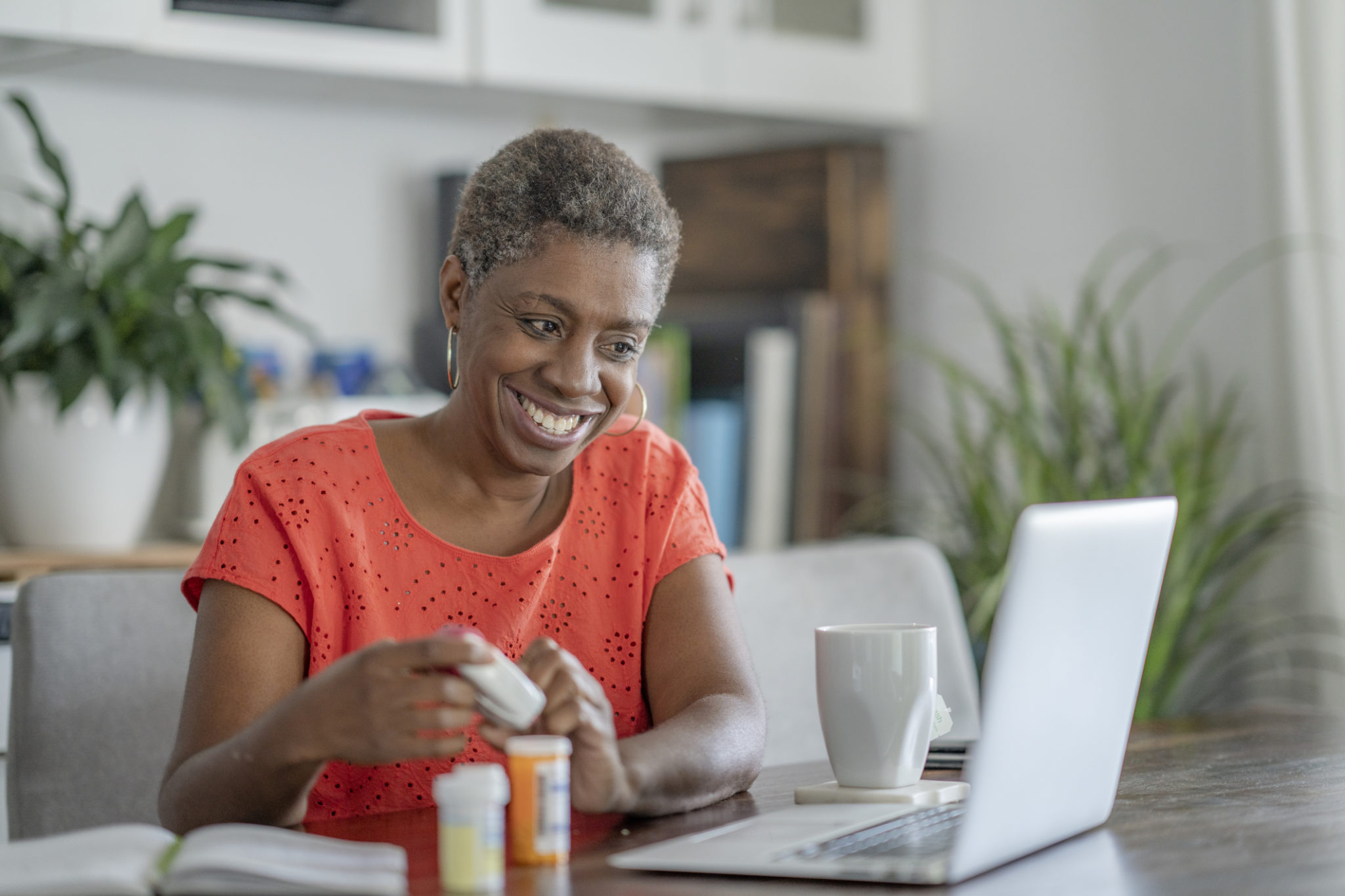 African American woman on a telemedicine call with her doctor - Center ...